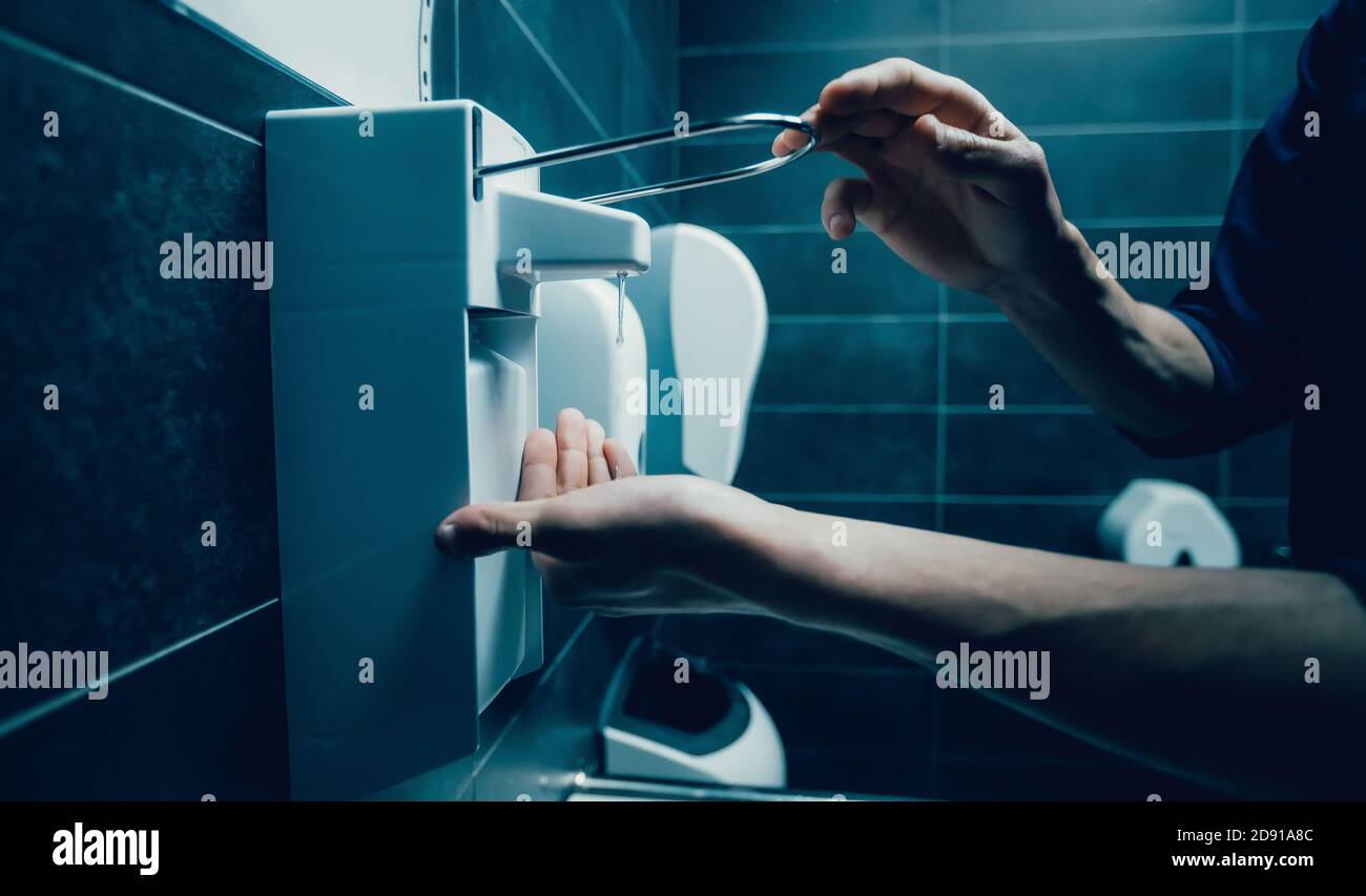 close up. young man using a bactericidal hand wash Stock Photo - Alamy