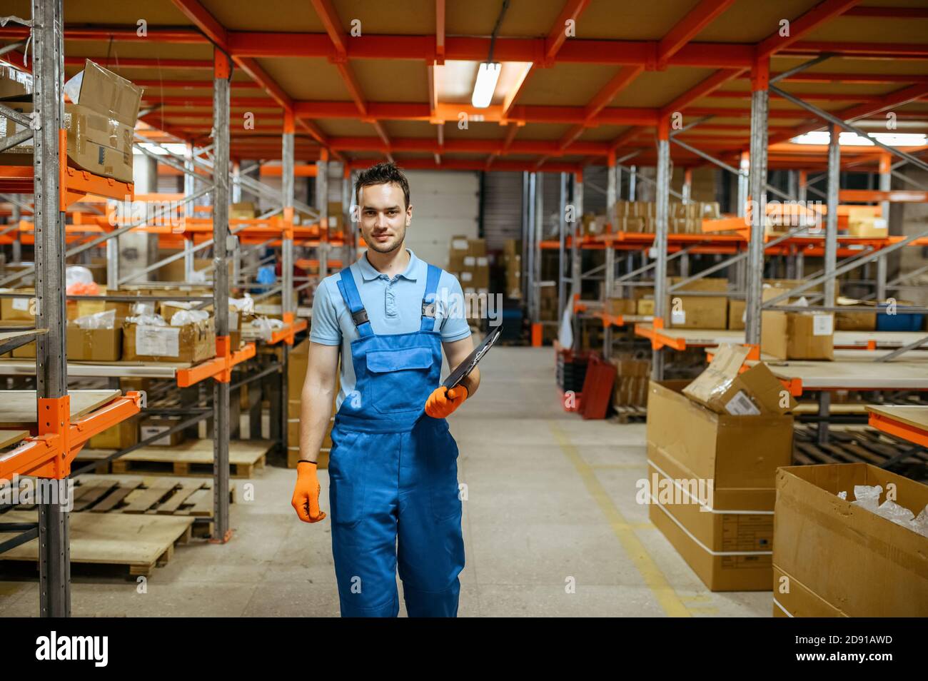 Bicycle factory, worker near the shelf, warehouse Stock Photo - Alamy