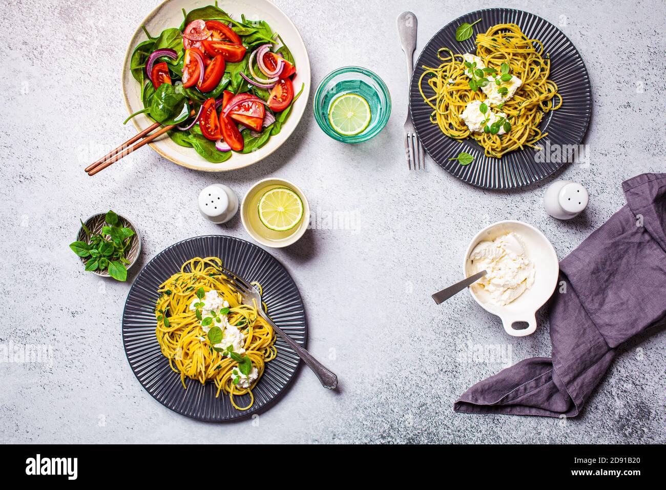 Family lunch table, top view. Italian pasta with ricotta and fresh ...
