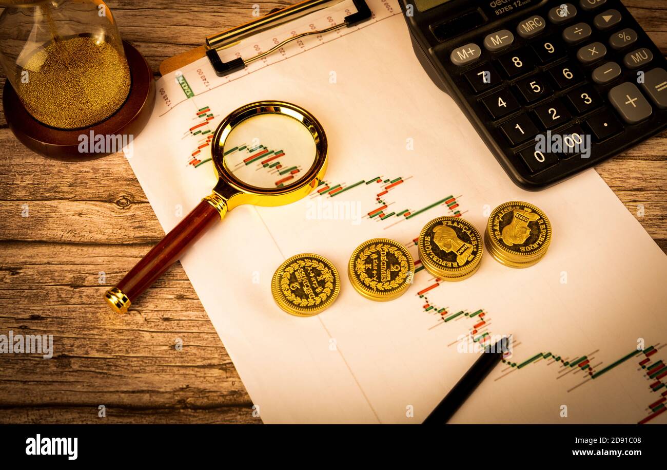 Coins, calculator, laptop and a diagram - accounting concept Stock ...