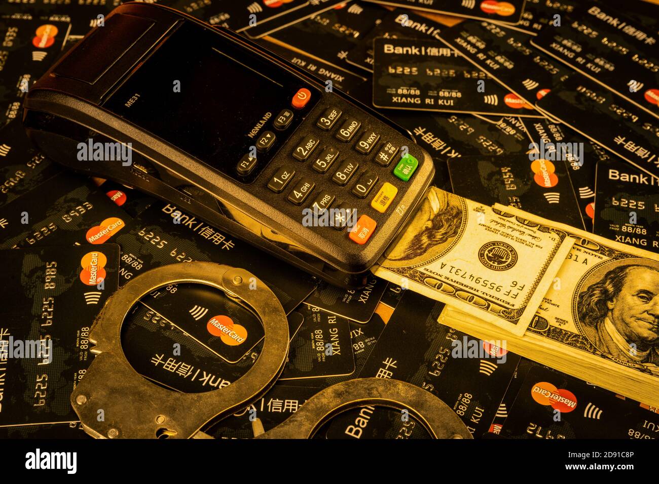 Payment terminal and handcuffs on credit cards - robbery concept Stock ...