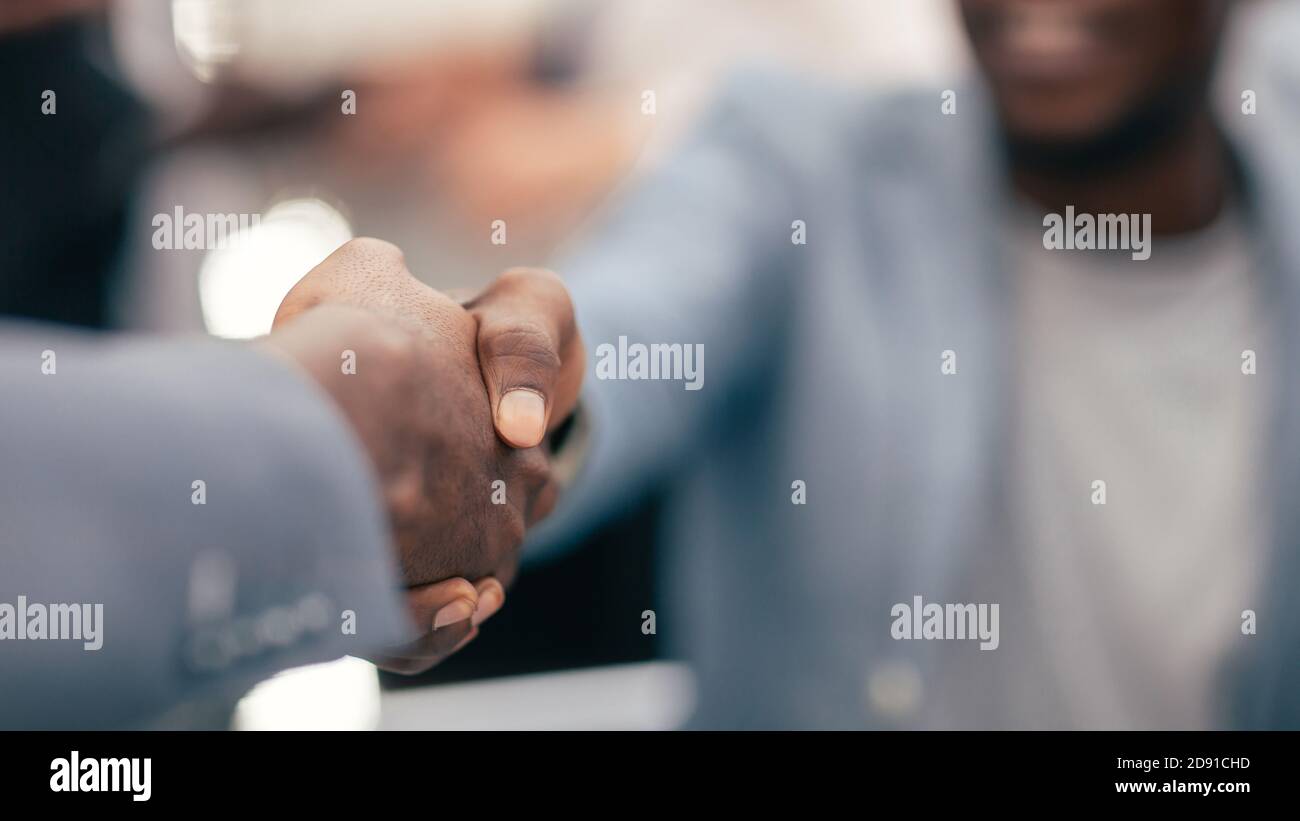 close up. business colleagues greeting each other with a handshake ...