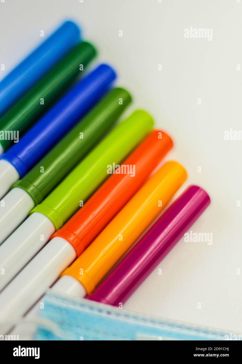 Color pencil and mask with light background Stock Photo - Alamy