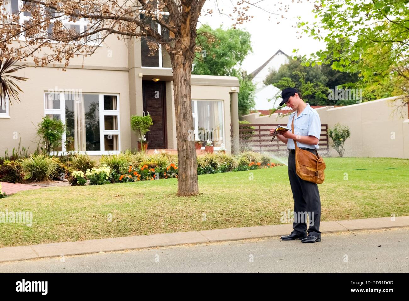 Johannesburg, South Africa - September 11, 2010: Postal Mailman hand ...