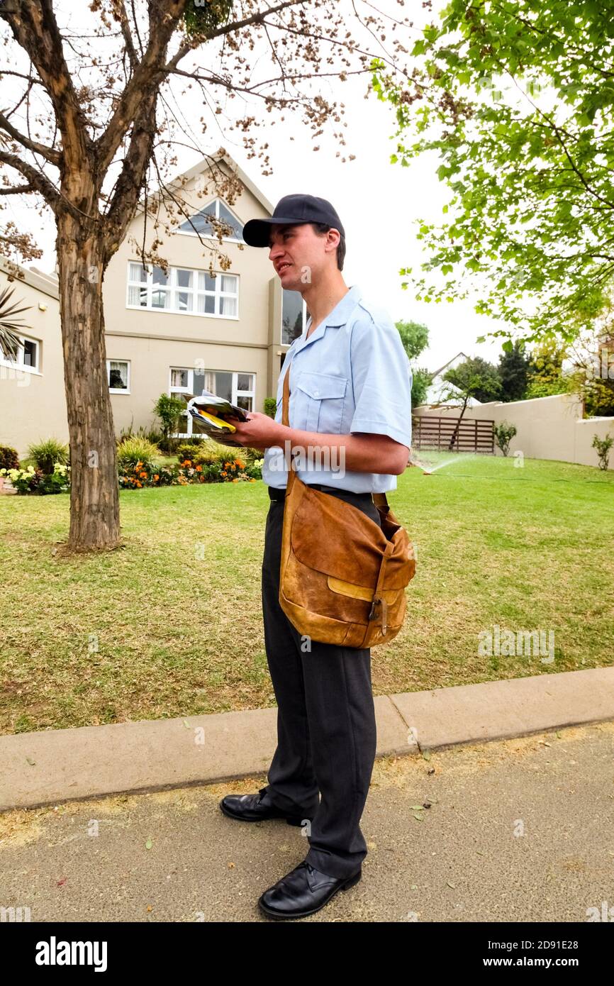 Johannesburg, South Africa - September 11, 2010: Postal Mailman hand ...