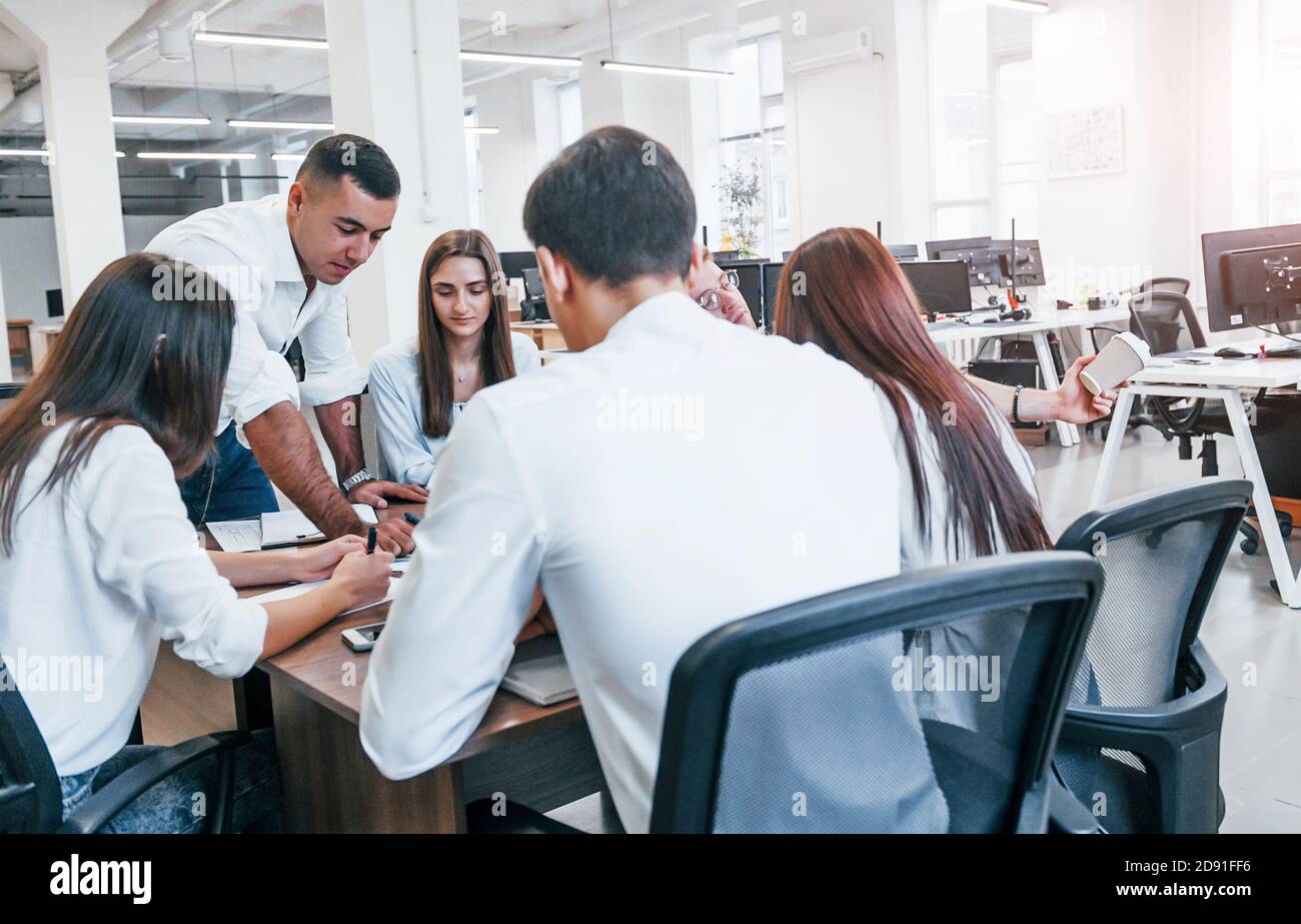 Concentrated group of people working on new project in the office Stock ...