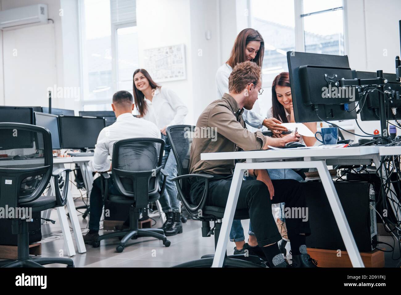 Group of young business people that working by computers in the modern ...