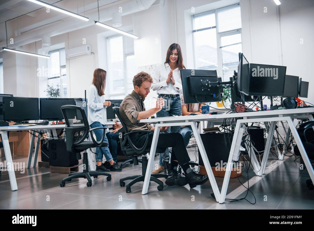 Group of young business people that working by computers in the modern ...