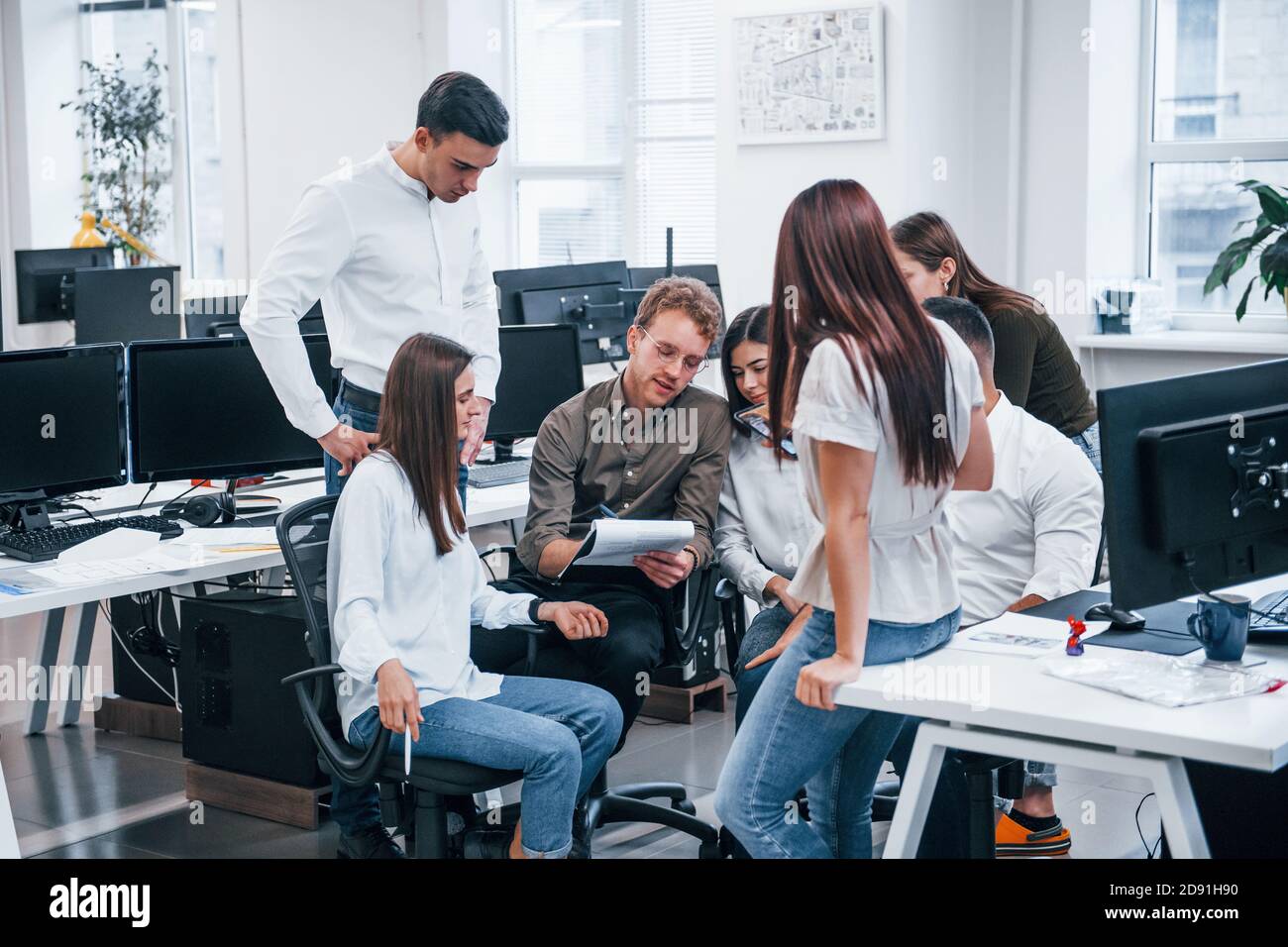 Concentrated group of people working on new project in the office Stock ...