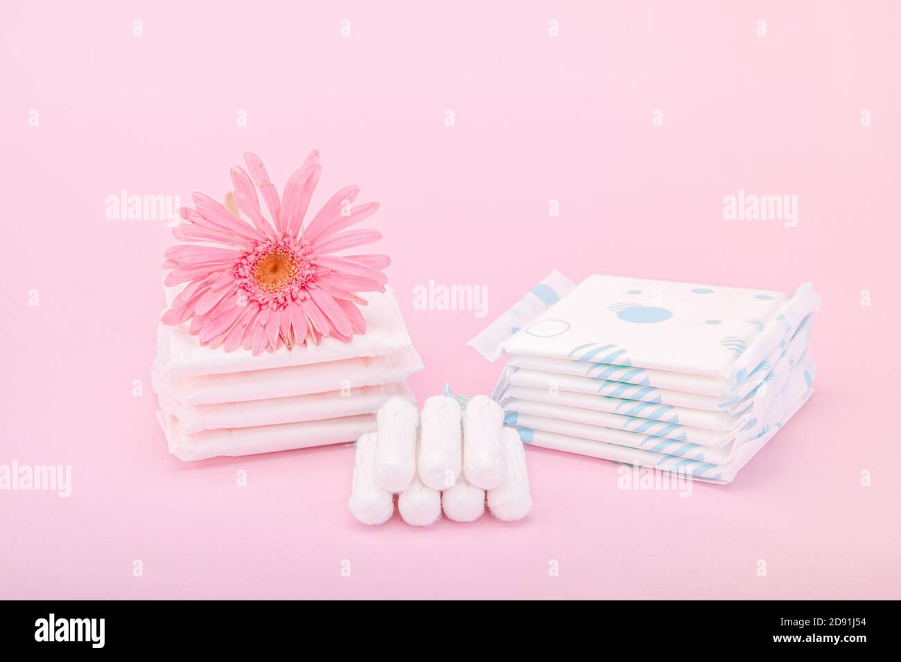 Sanitary pads and tampons on a pink background Stock Photo - Alamy
