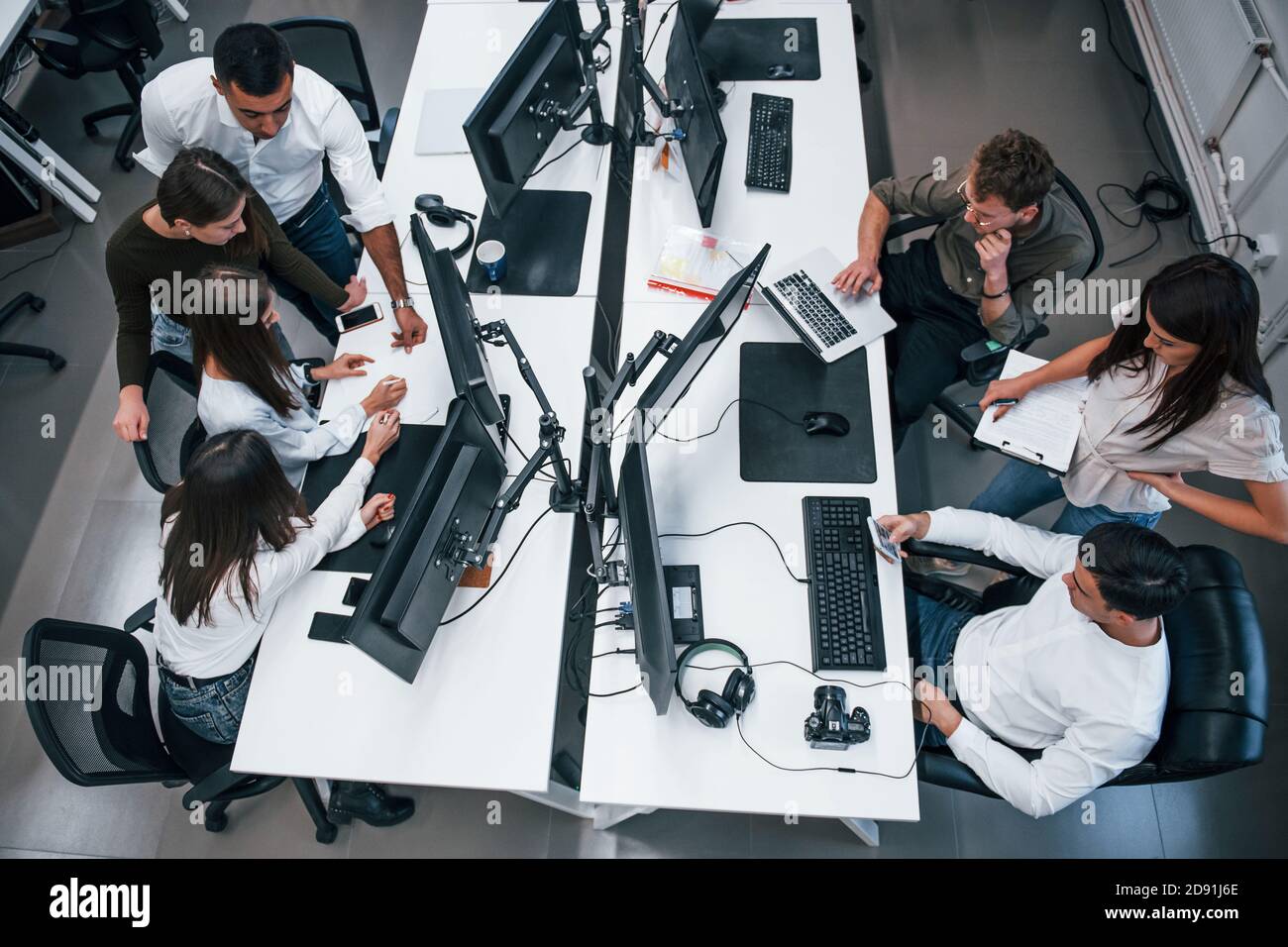 Group of young business people that working by computers in the modern ...