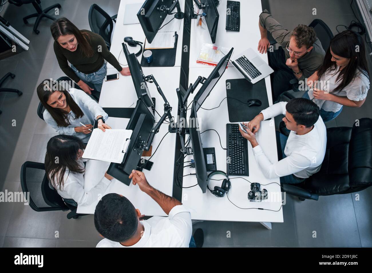 Group of young business people that working by computers in the modern ...