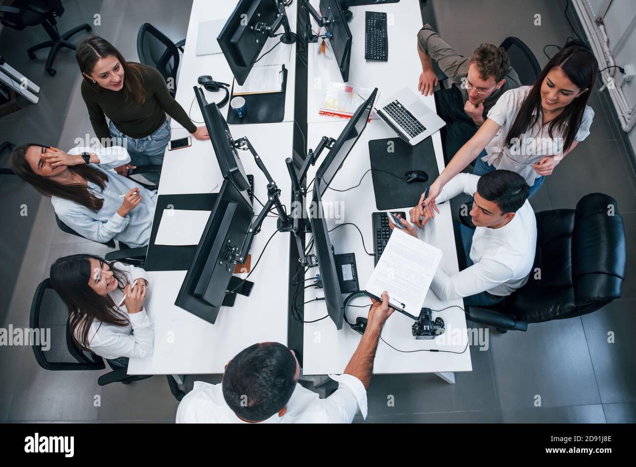 Group of young business people that working by computers in the modern ...