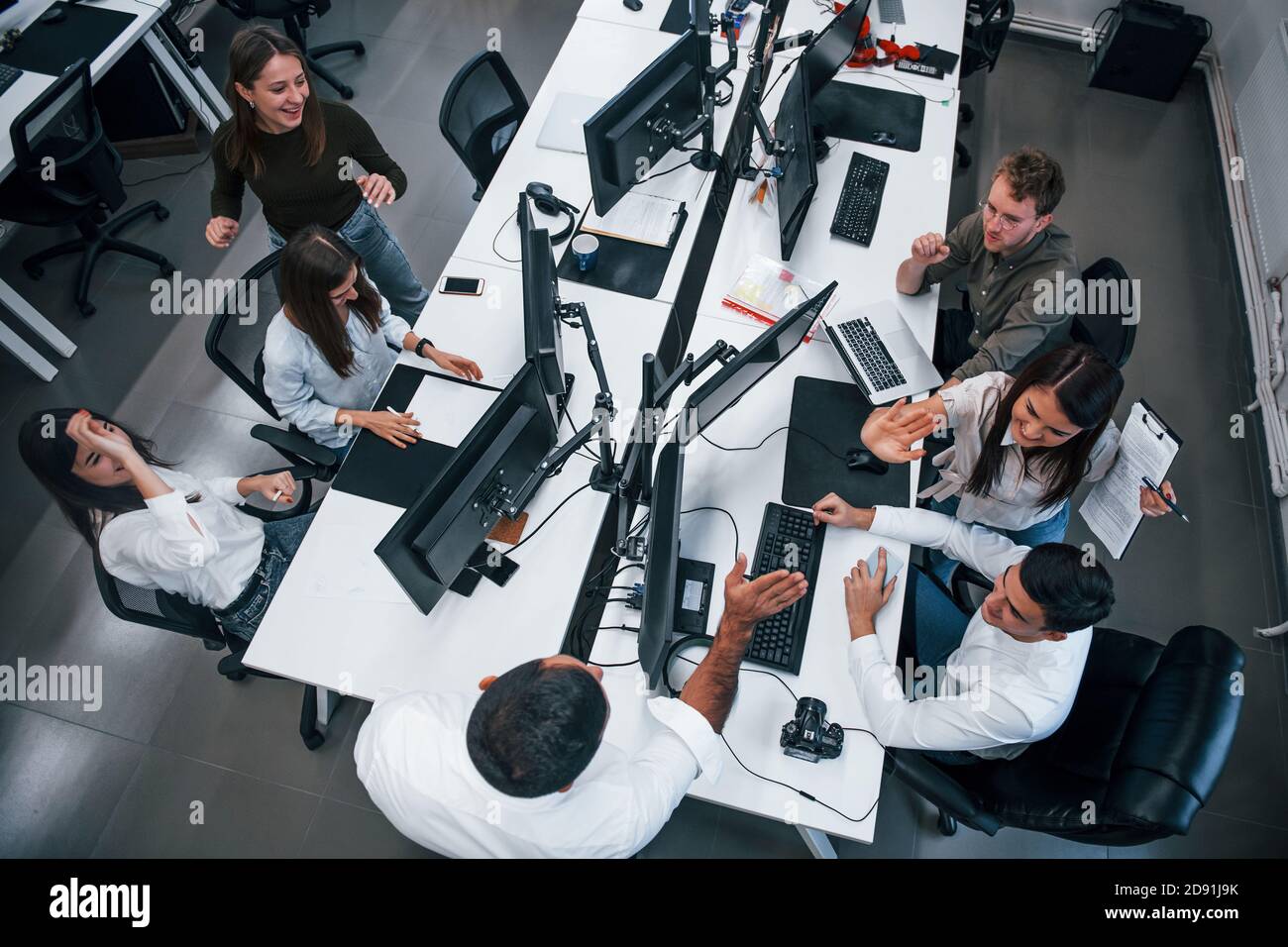 Group of young business people that working by computers in the modern ...