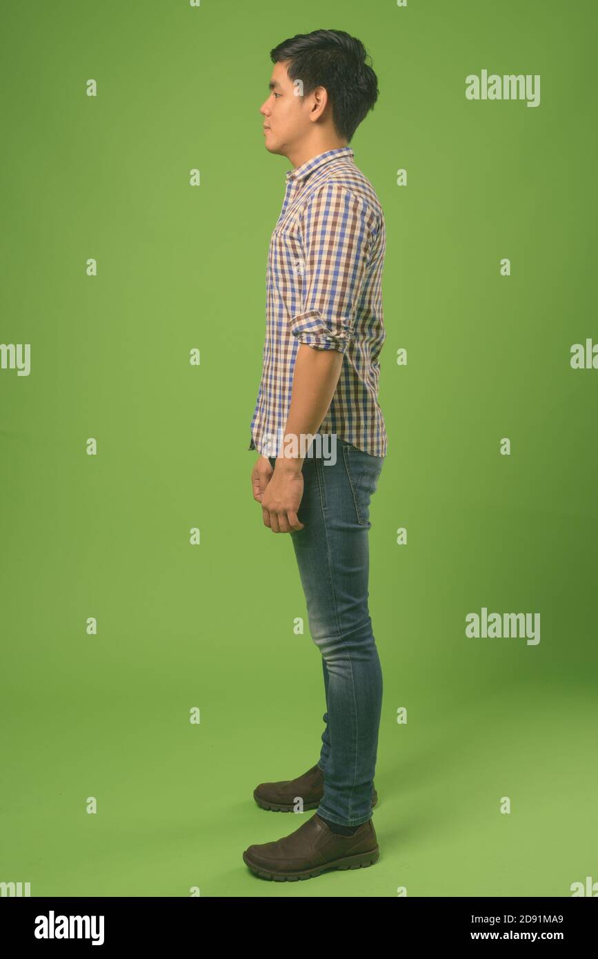 Young handsome Filipino man against green background Stock Photo - Alamy