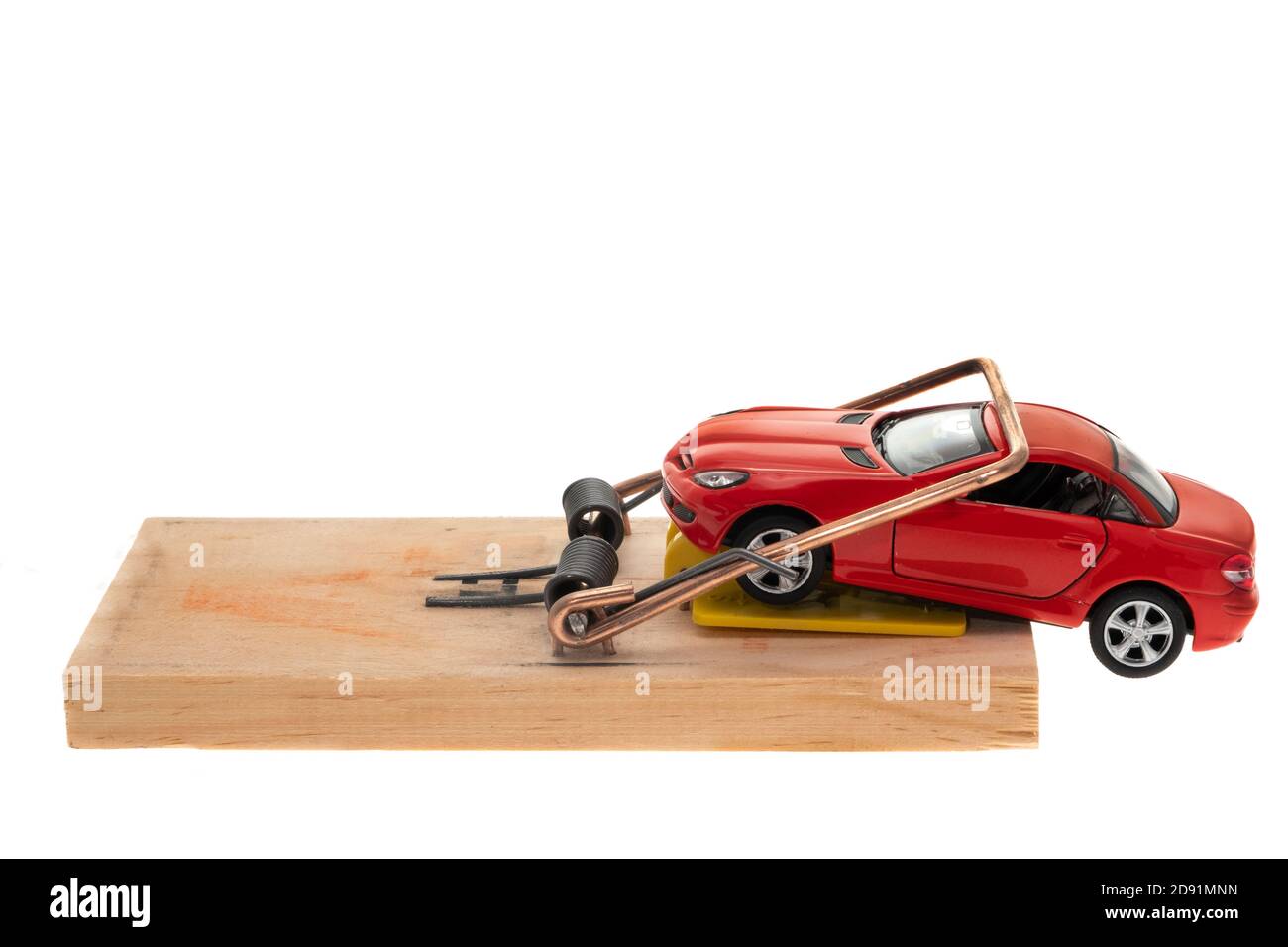A concept image of a car caught in a mouse trap - white background ...