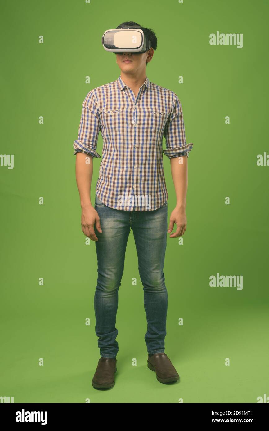 Young handsome Filipino man against green background Stock Photo - Alamy