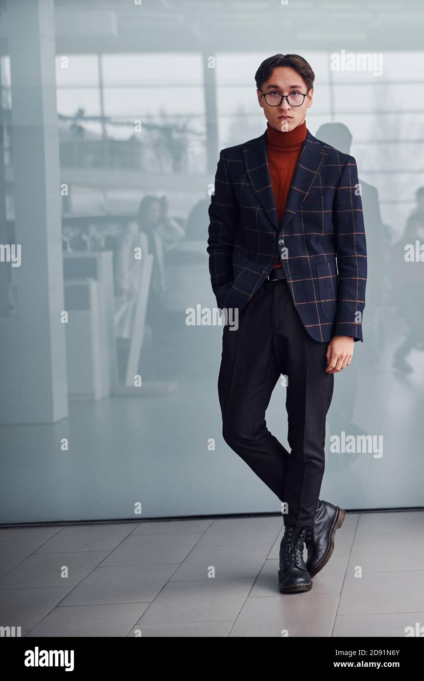 Young business man in luxury suit and formal clothes posing for the ...