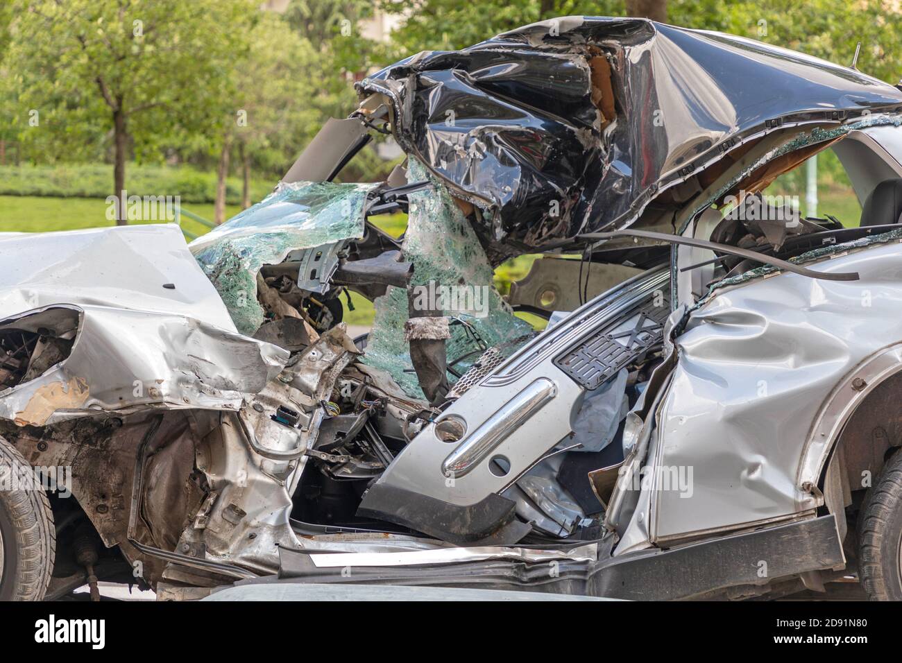 Crushed Small Car Damaged in Traffic Accident Stock Photo - Alamy