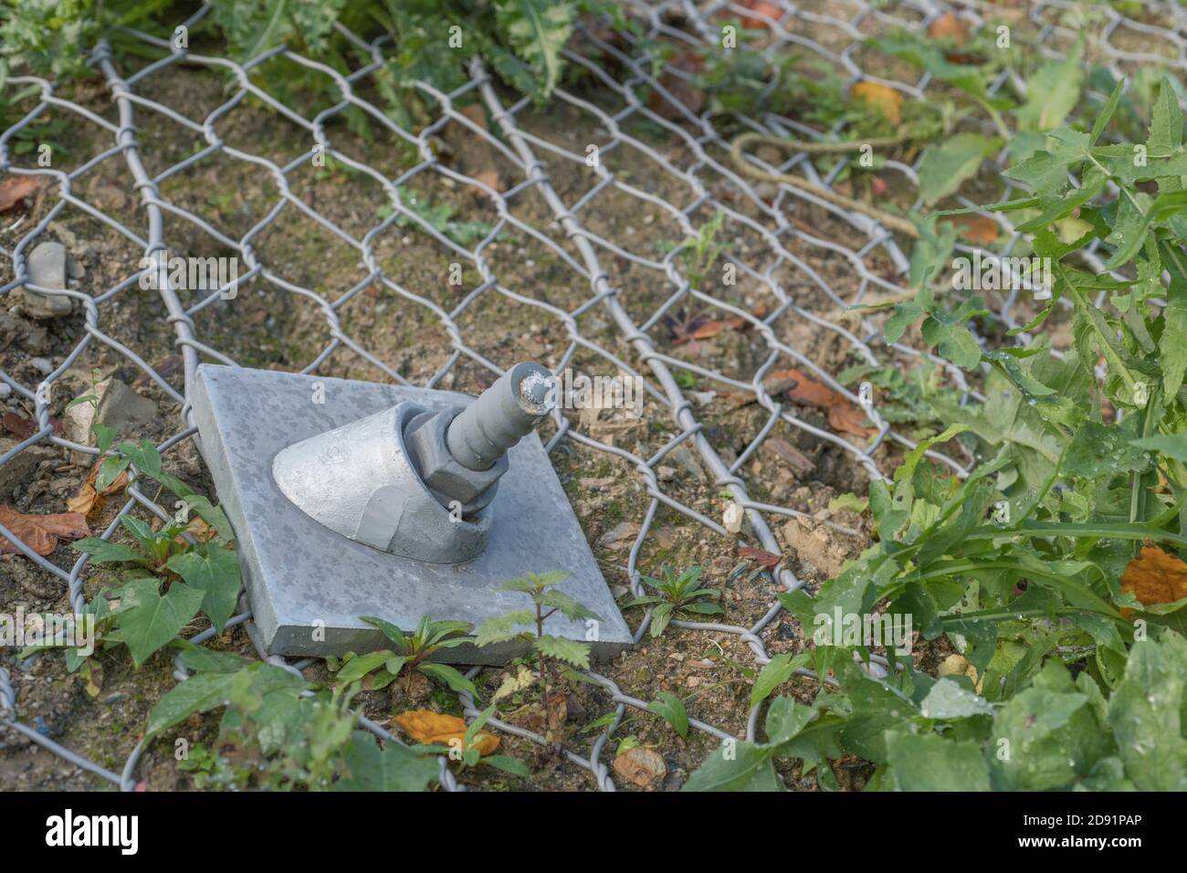 Chain link rockfall protection mesh and anchor in the town of ...