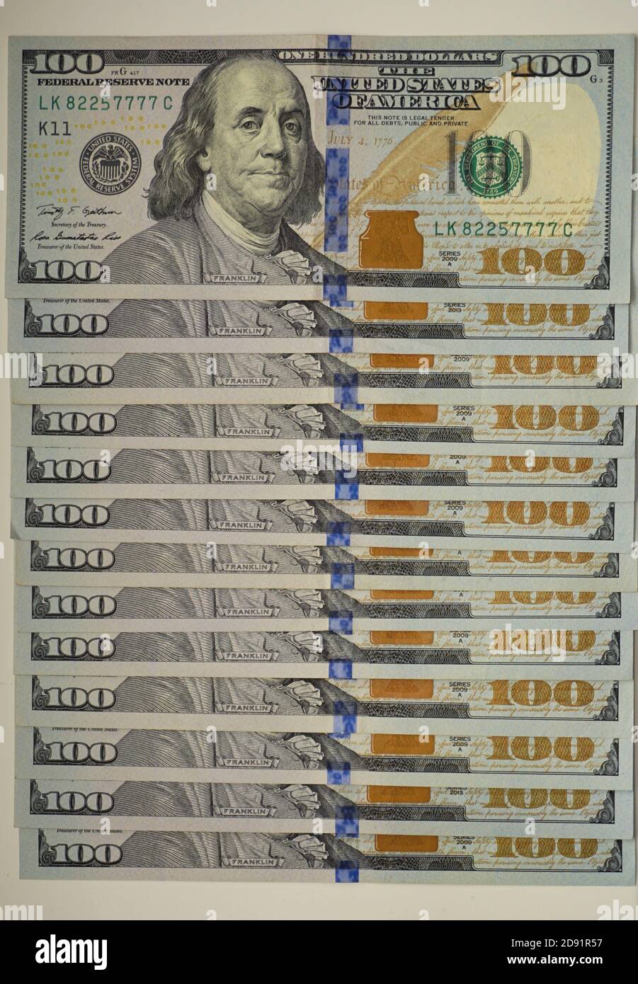 Lots of 100 US dollar bills in a line. Pile of old one hundred dollar ...