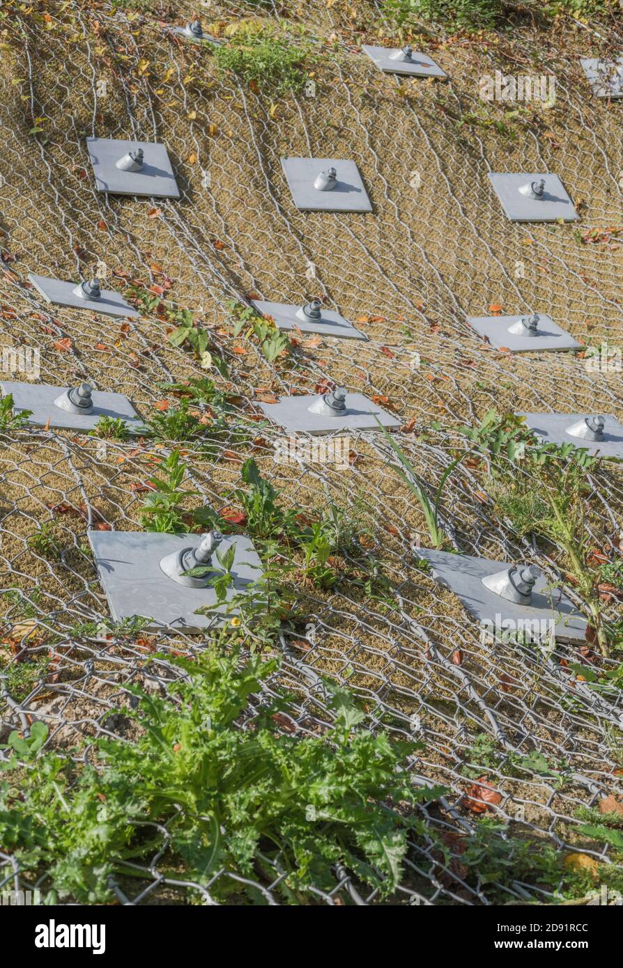 Chain link rockfall protection mesh and anchor in the town of ...