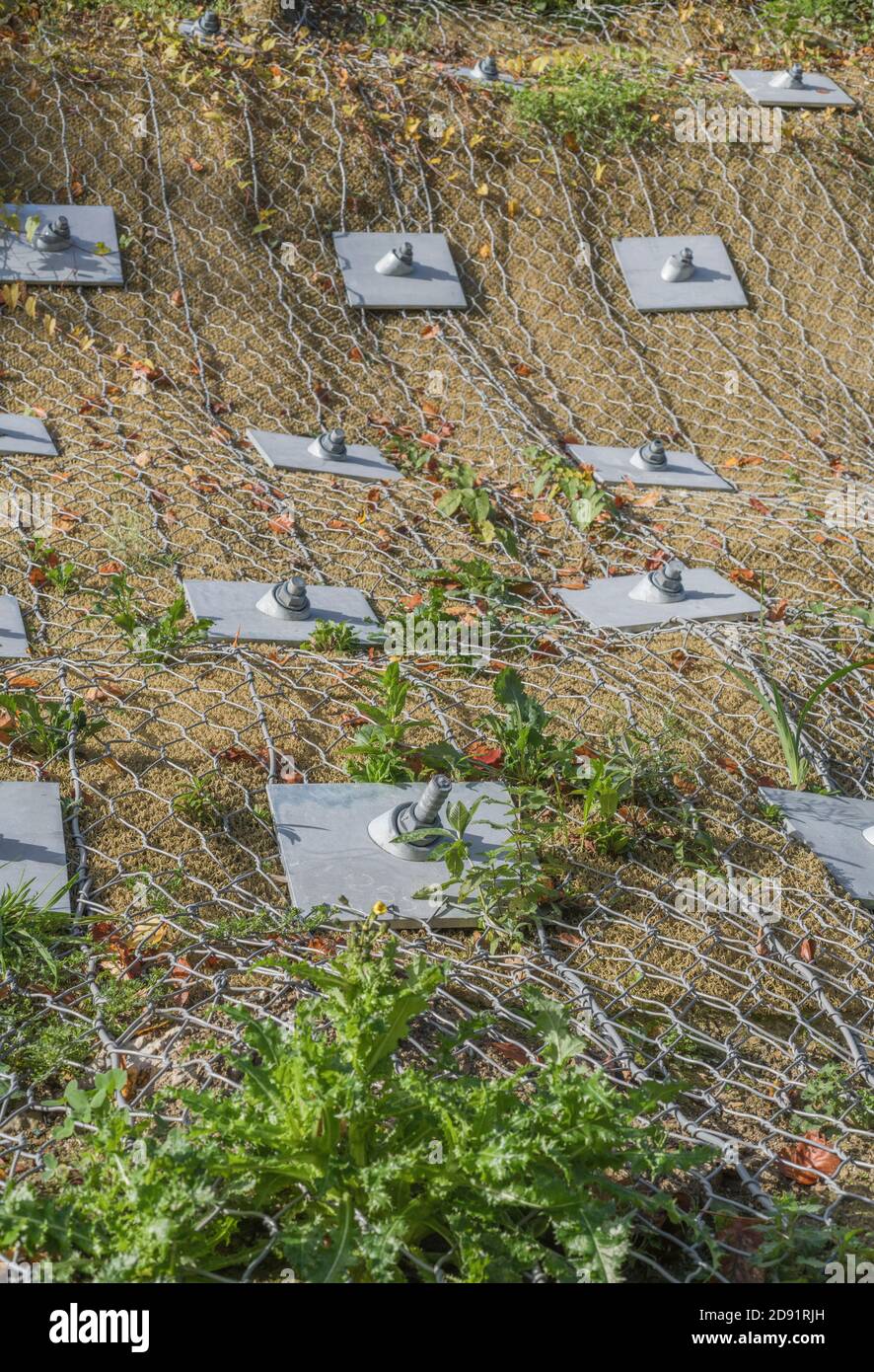 Chain link rockfall protection mesh and anchor in the town of ...