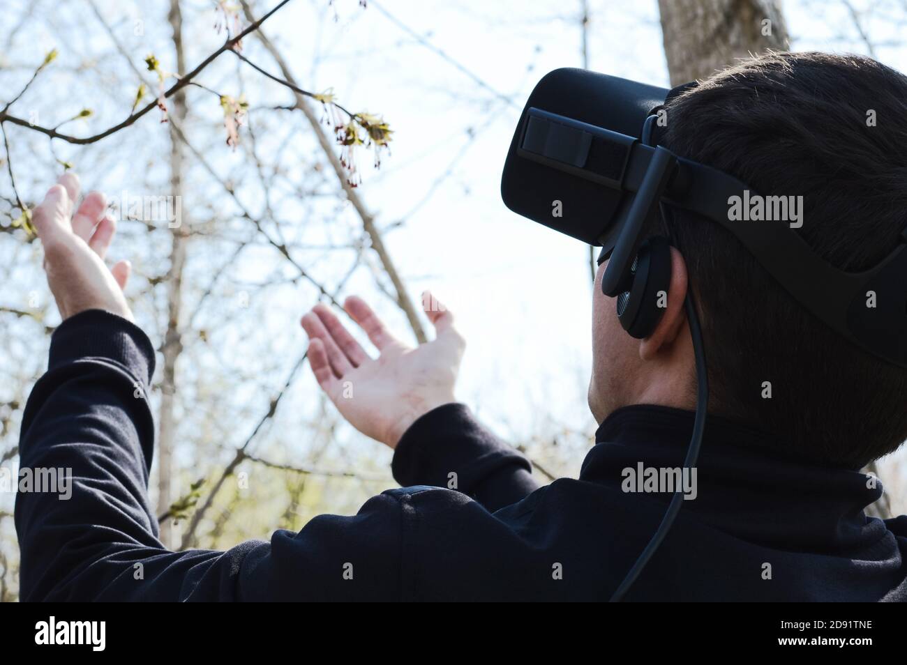 young man try VR glasses, virtual technologies help people in realistic ...