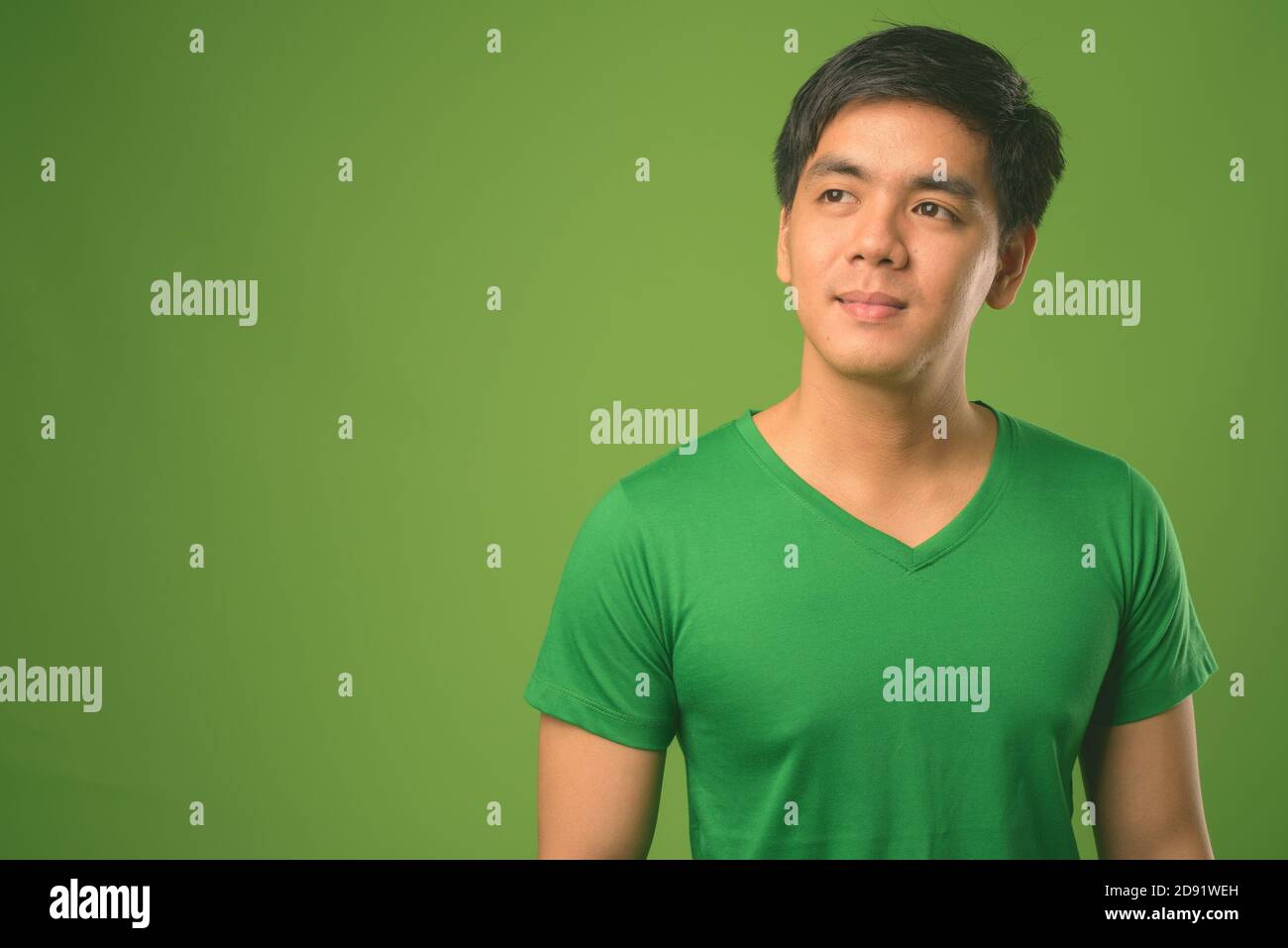 Young handsome Filipino man against green background Stock Photo - Alamy
