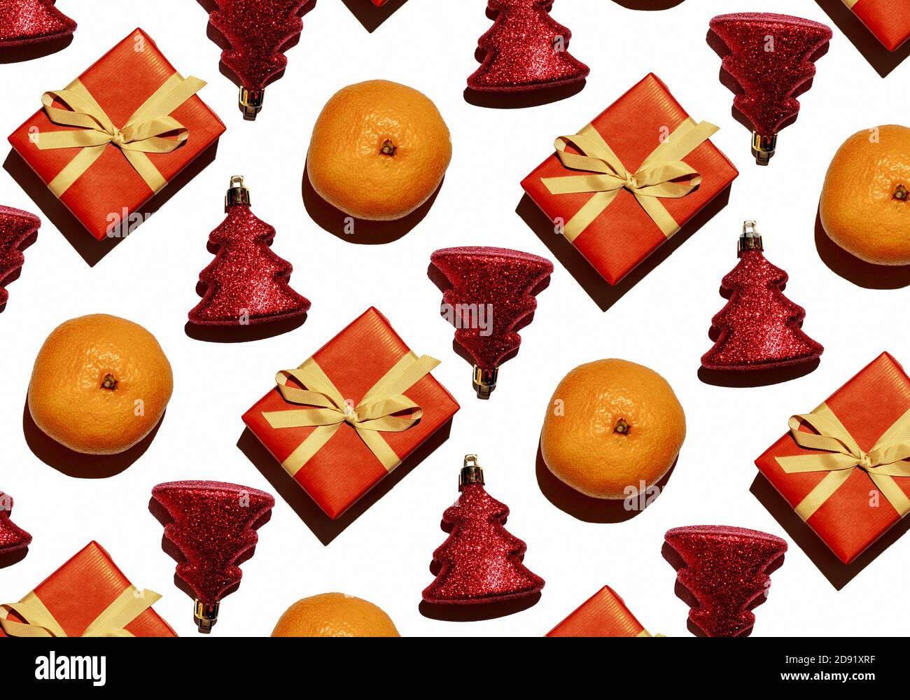 Pattern from tangerines, shiny red toys in the form of a Christmas tree ...