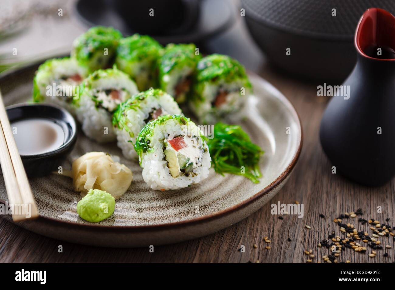 Sushi maki rolls with cucumber, avocado, tomato, creamy cheese, chuka ...