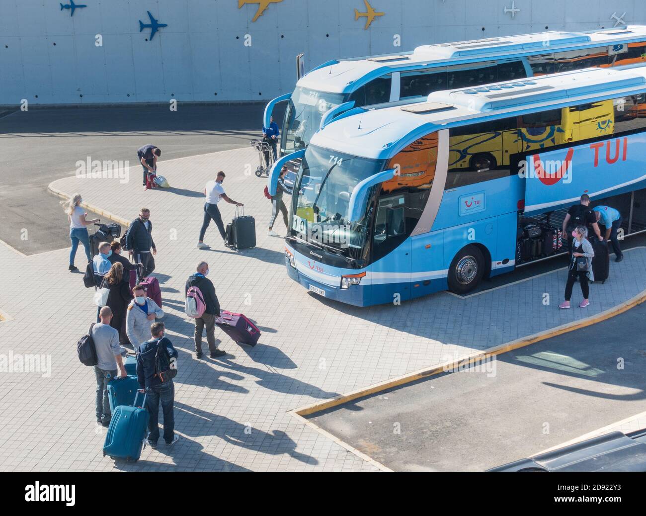 TUI clients, tourists boarding coaches at Gran Canaria airport. Canary ...