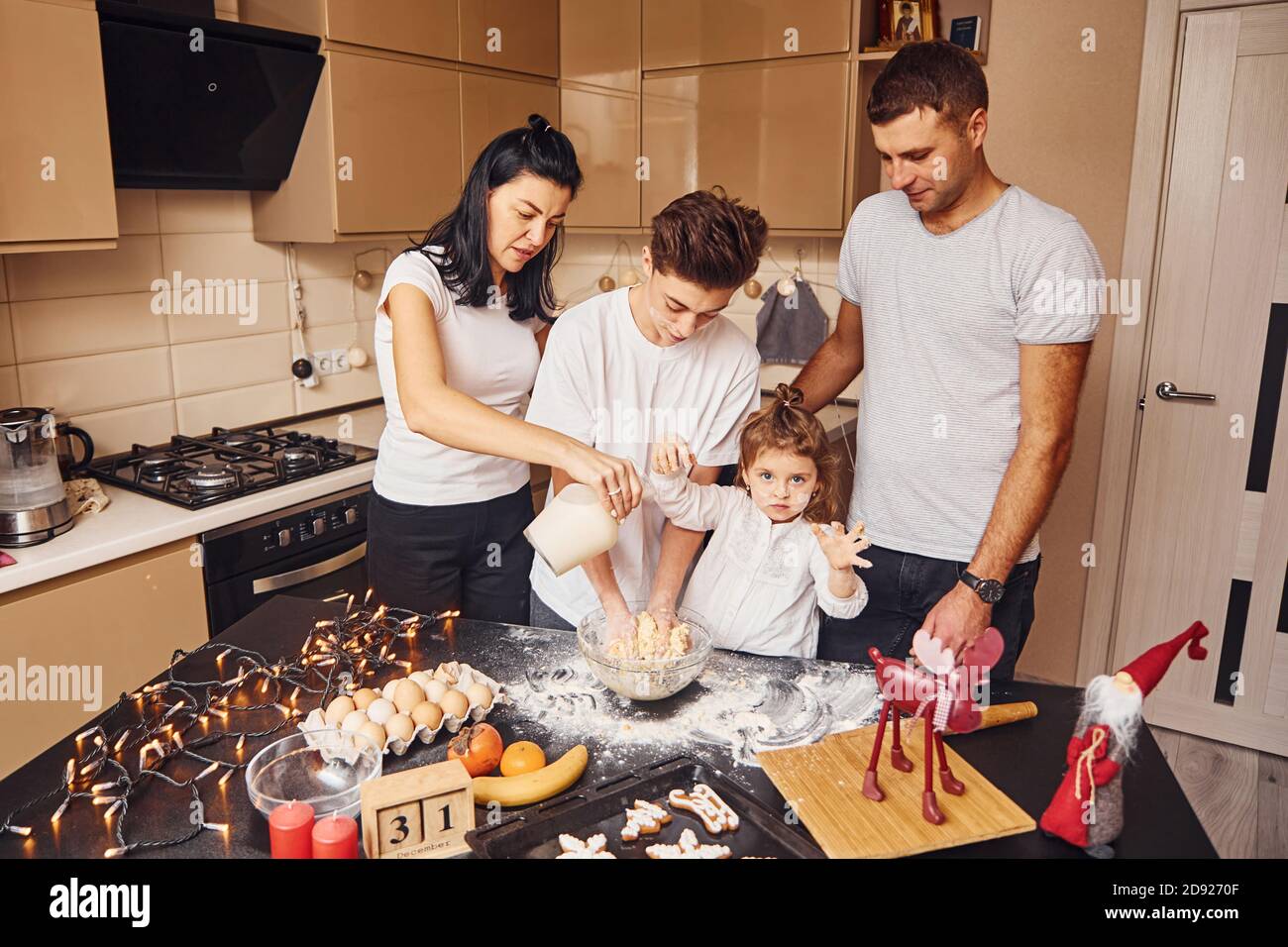 Happy family have fun on the kitchen and preparing food Stock Photo - Alamy