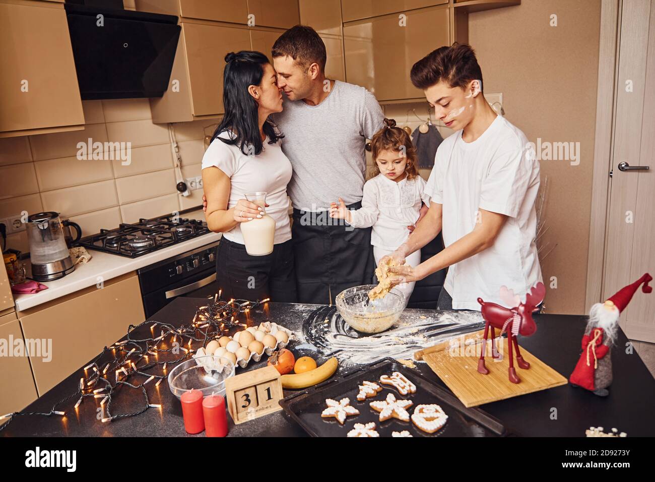 Happy family have fun on the kitchen and preparing food Stock Photo - Alamy