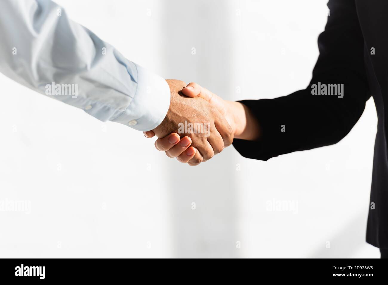 partial view of politicians shaking hands on white Stock Photo - Alamy