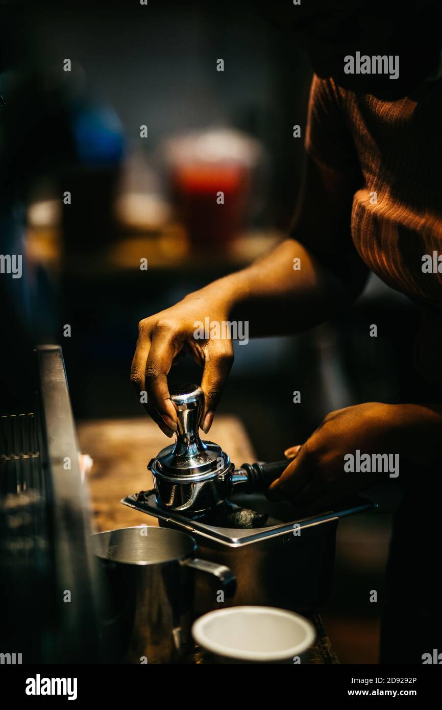 Vertical shot of a barista making coffee in the bar counter bar counter ...