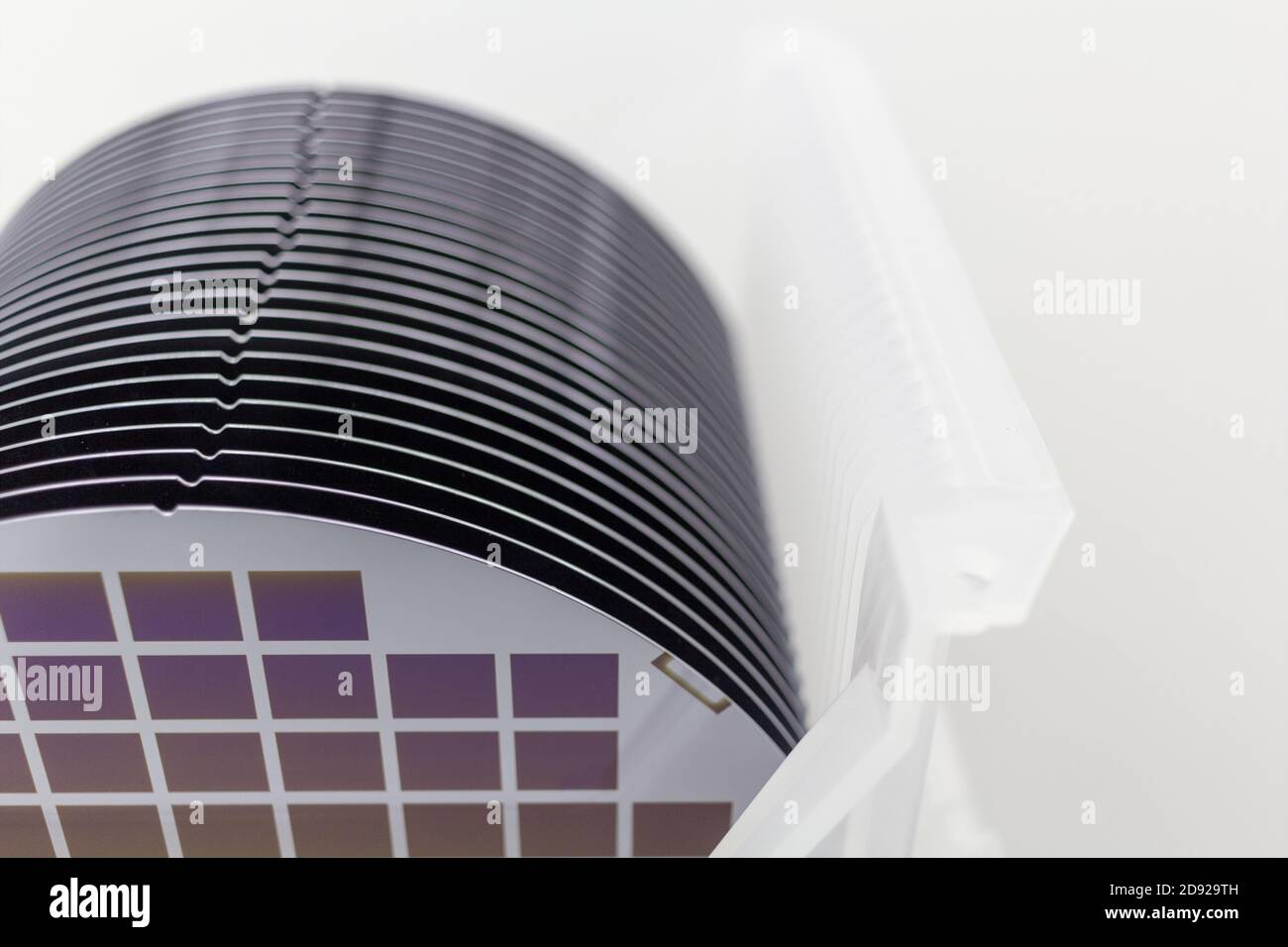 Silicon Wafers in white plastic holder box on a table- A wafer is a ...