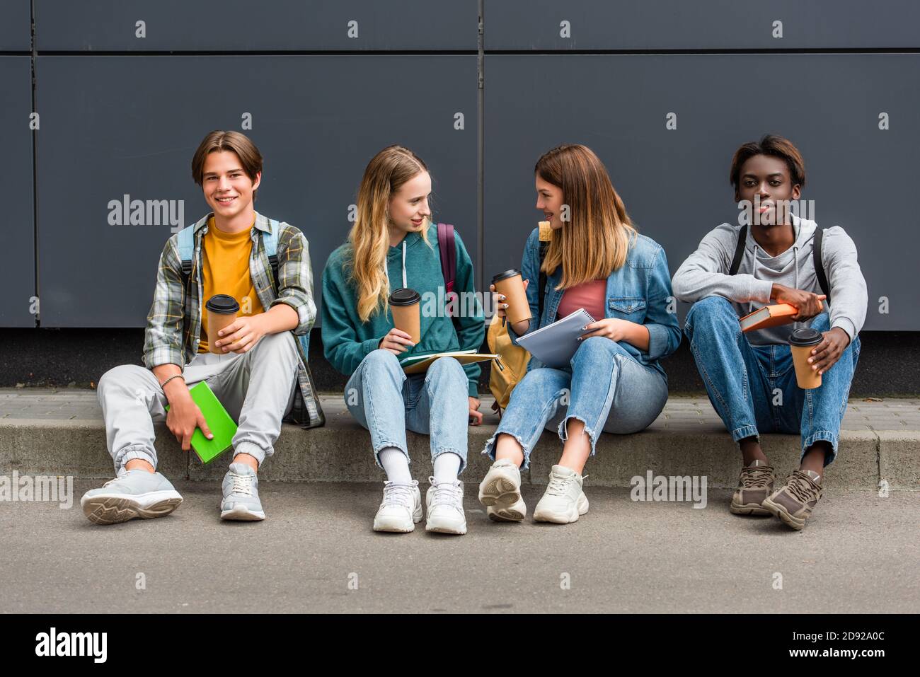 Teen girls talking outside hi-res stock photography and images - Alamy
