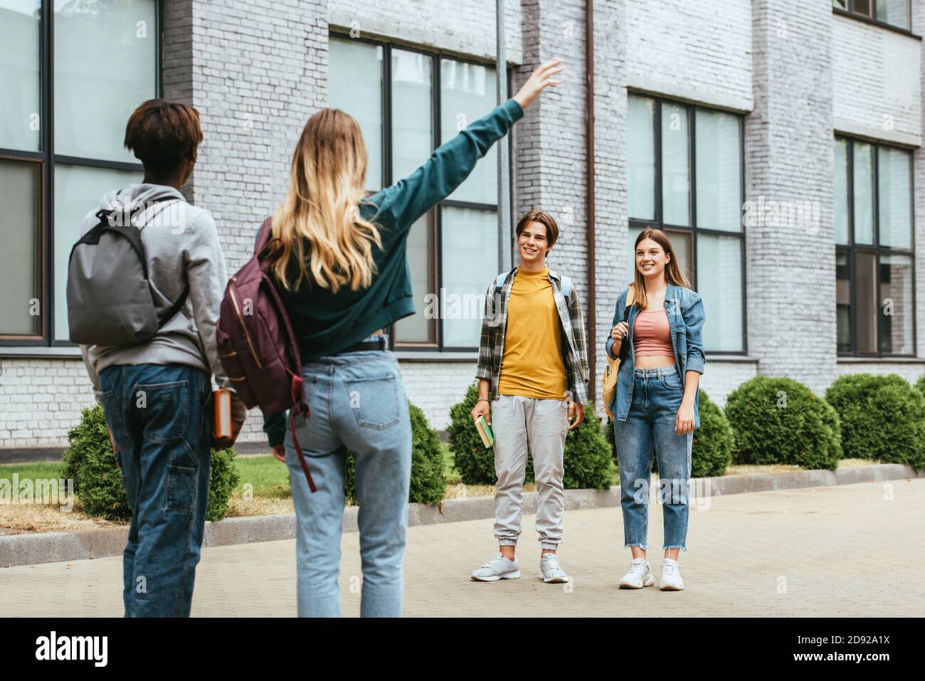 Teenage friends greeting hi-res stock photography and images - Alamy