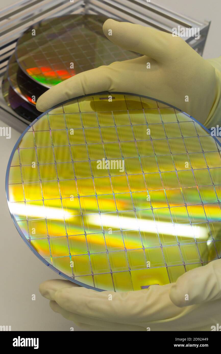 Silicon Wafers in steel holder box take out by hand in gloves- A wafer ...