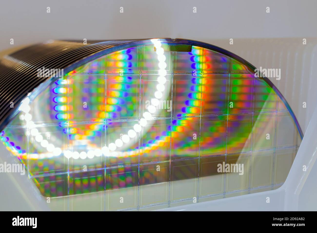 Silicon Wafers in white plastic holder box on a table- A wafer is a ...