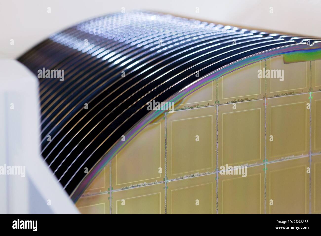 Silicon Wafers in white plastic holder box on a table- A wafer is a ...