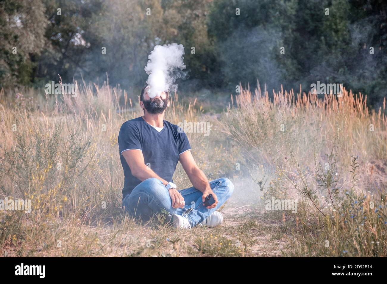 Adult man smokes tobacco using hi-res stock photography and images - Alamy