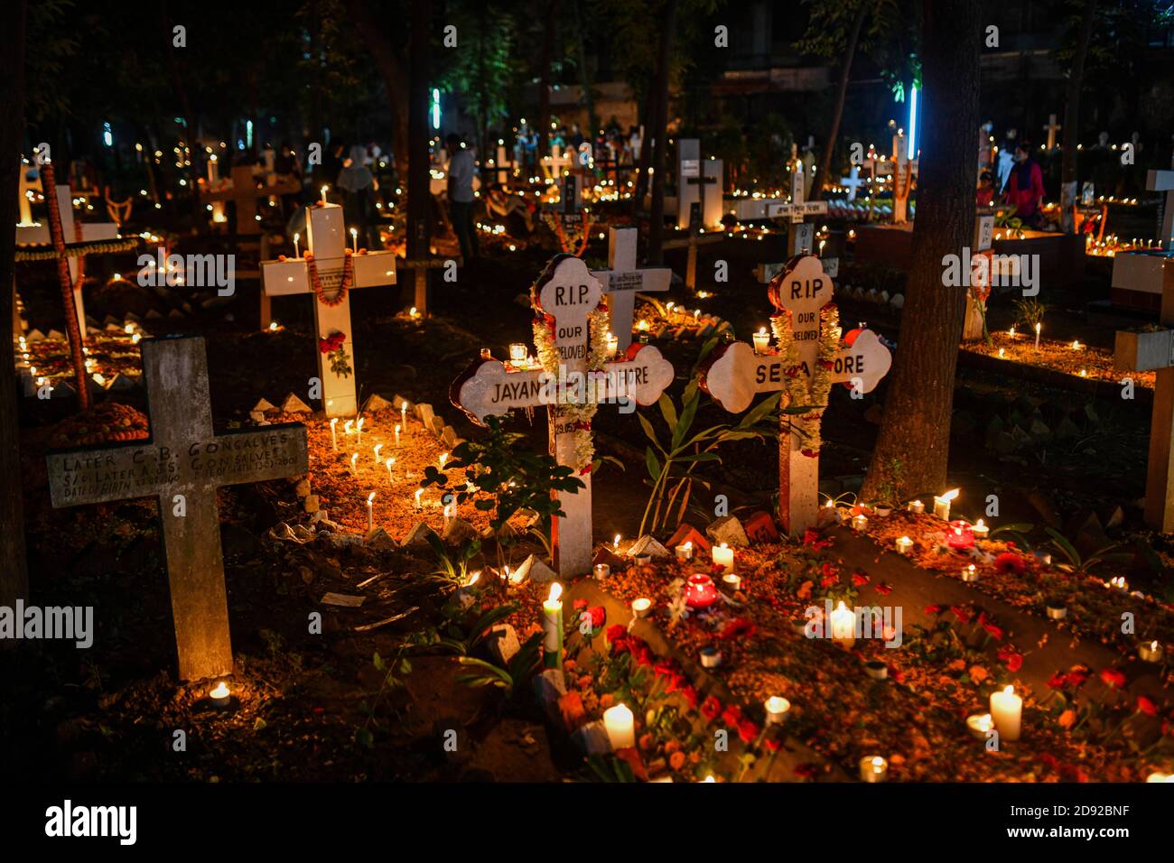 Christian community lit candles by the graves of their relatives during ...