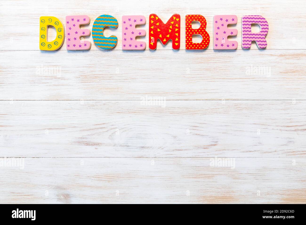 Wooden letters written December month on vintage background ...