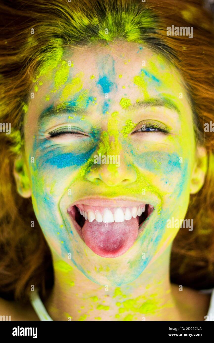 Overhead view of the smiling beautiful woman with her face covered in ...