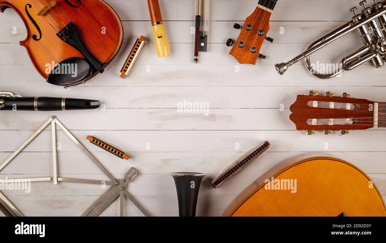 instruments in white wooden background Stock Photo - Alamy
