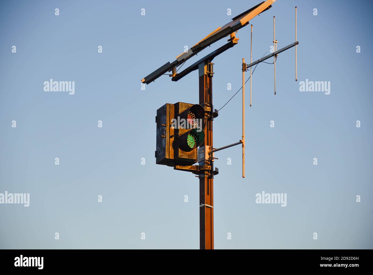 Railway traffic light. data transmission antenna. sky on blue ...
