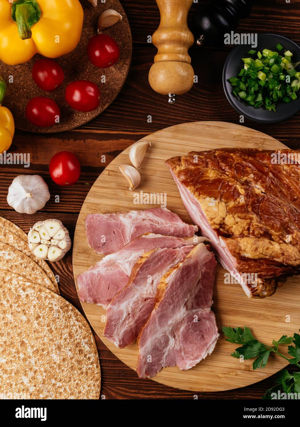 ham sliced on a background with vegetables and spices Stock Photo - Alamy