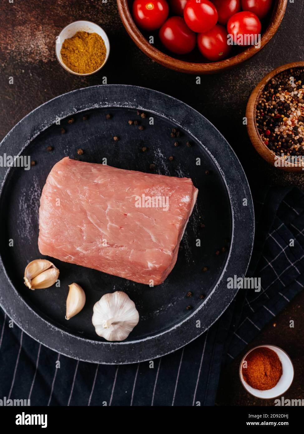 fresh pork meat with spices and vegetables Stock Photo - Alamy